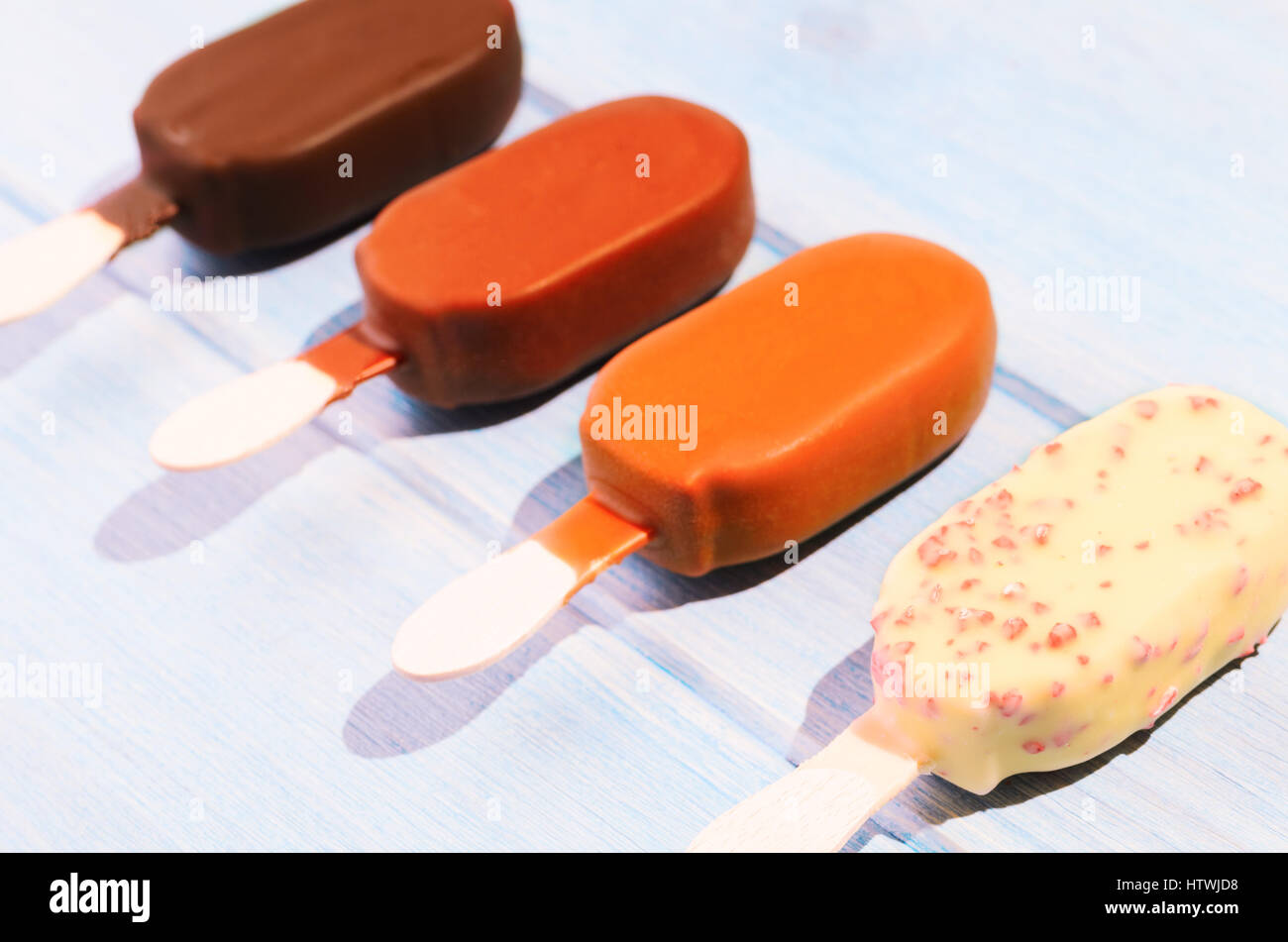 Ice creams on wooden background hi-res stock photography and images - Alamy