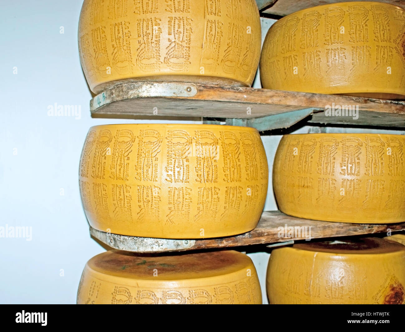PARMA, ITALY - APRIL 24, 2012: The marked wheels of parmesan in ...