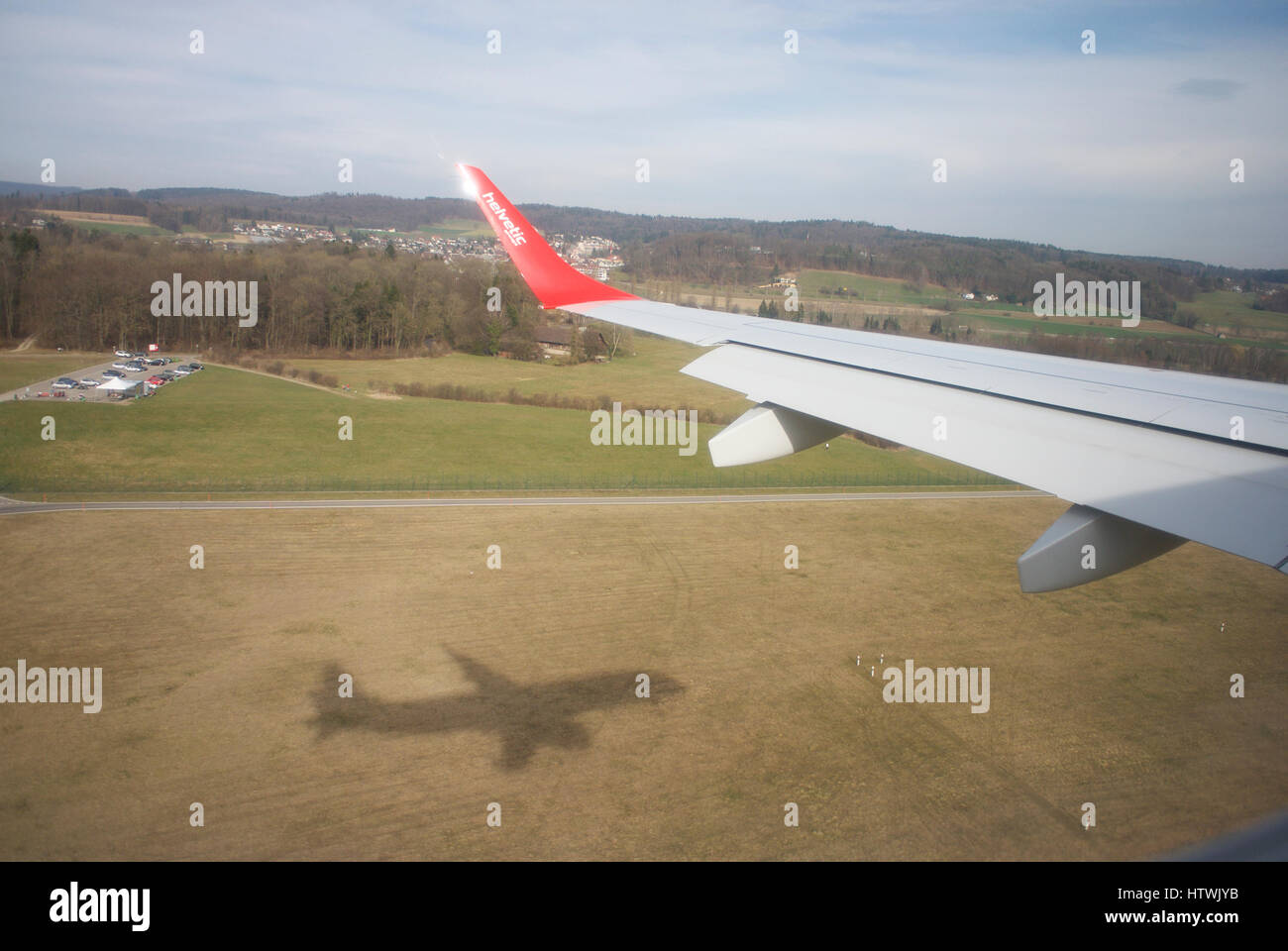 Shadow of plane while landing Stock Photo - Alamy