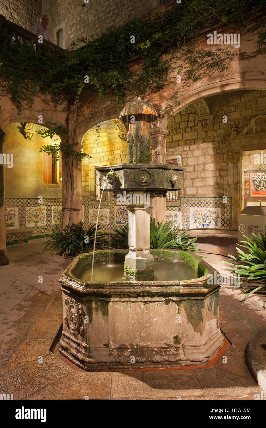 Spain, Barcelona, courtyard and fountain of Casa de l’Ardiaca ...
