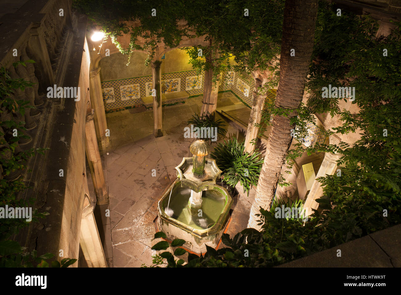 Spain, Barcelona, courtyard and fountain of Casa de l’Ardiaca House ...