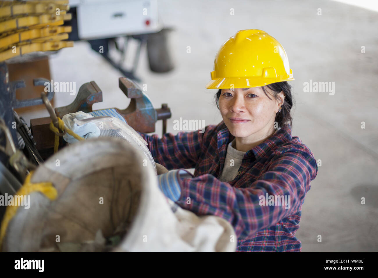 Female power engineer working in service garage Stock Photo - Alamy