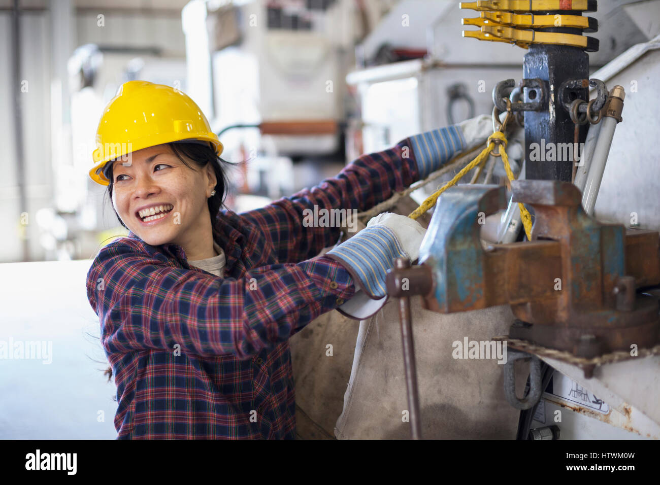 Female power engineer securing equipment on bucket truck Stock Photo ...