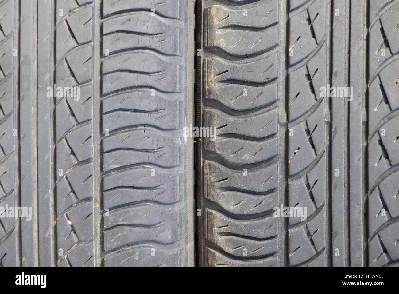 The background of the tread pattern of the car wheel. Rubber tires ...
