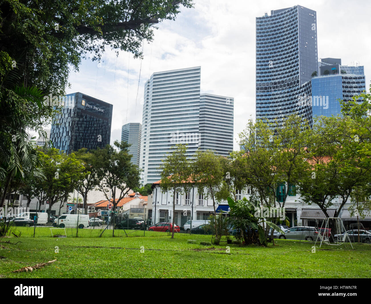 A contrast of modern high rise towers and traditional shophouses in ...
