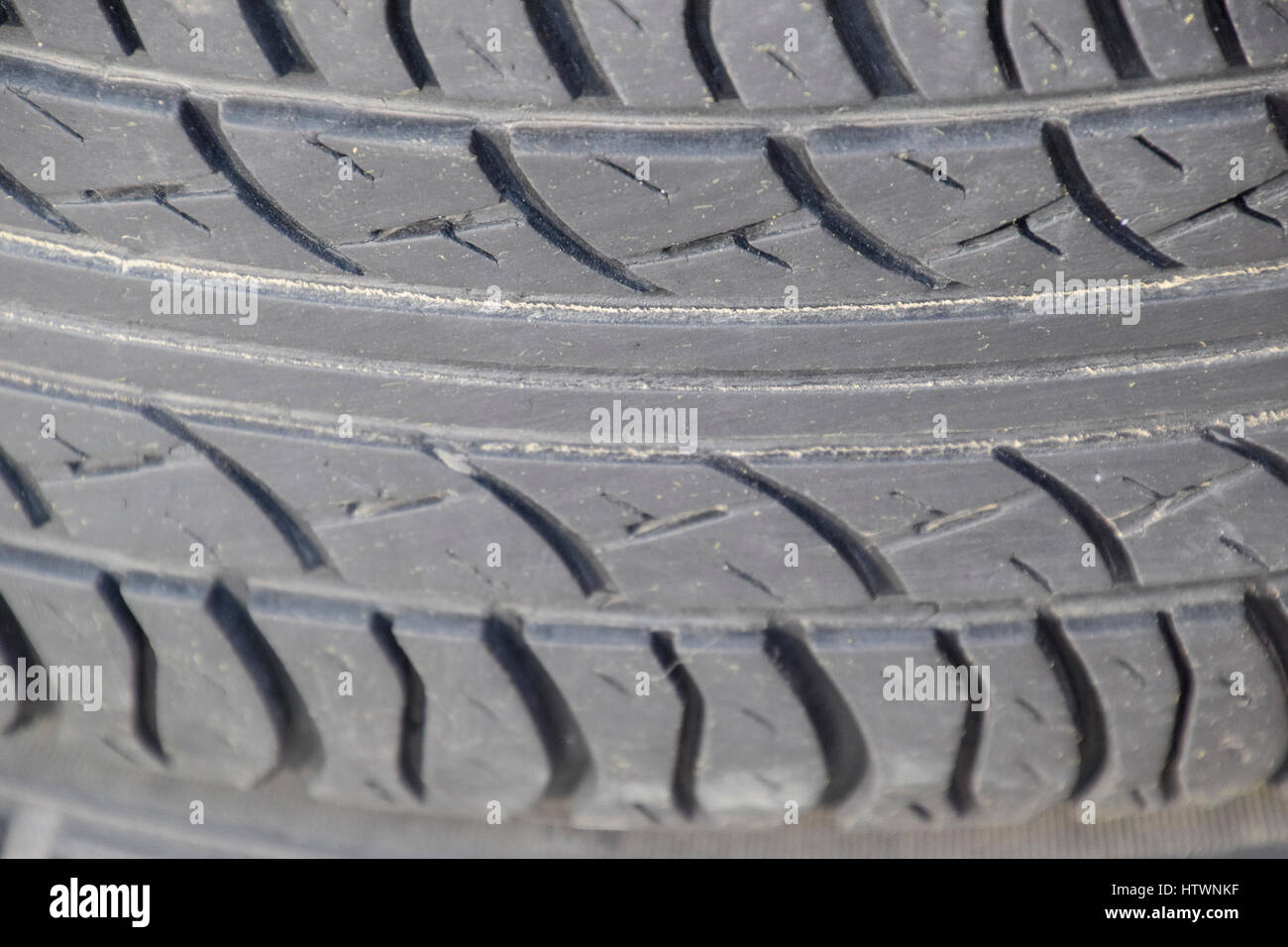 The background of the tread pattern of the car wheel. Rubber tires ...