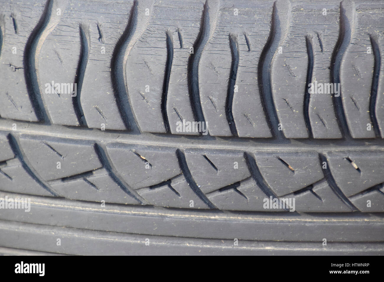 The background of the tread pattern of the car wheel. Rubber tires ...