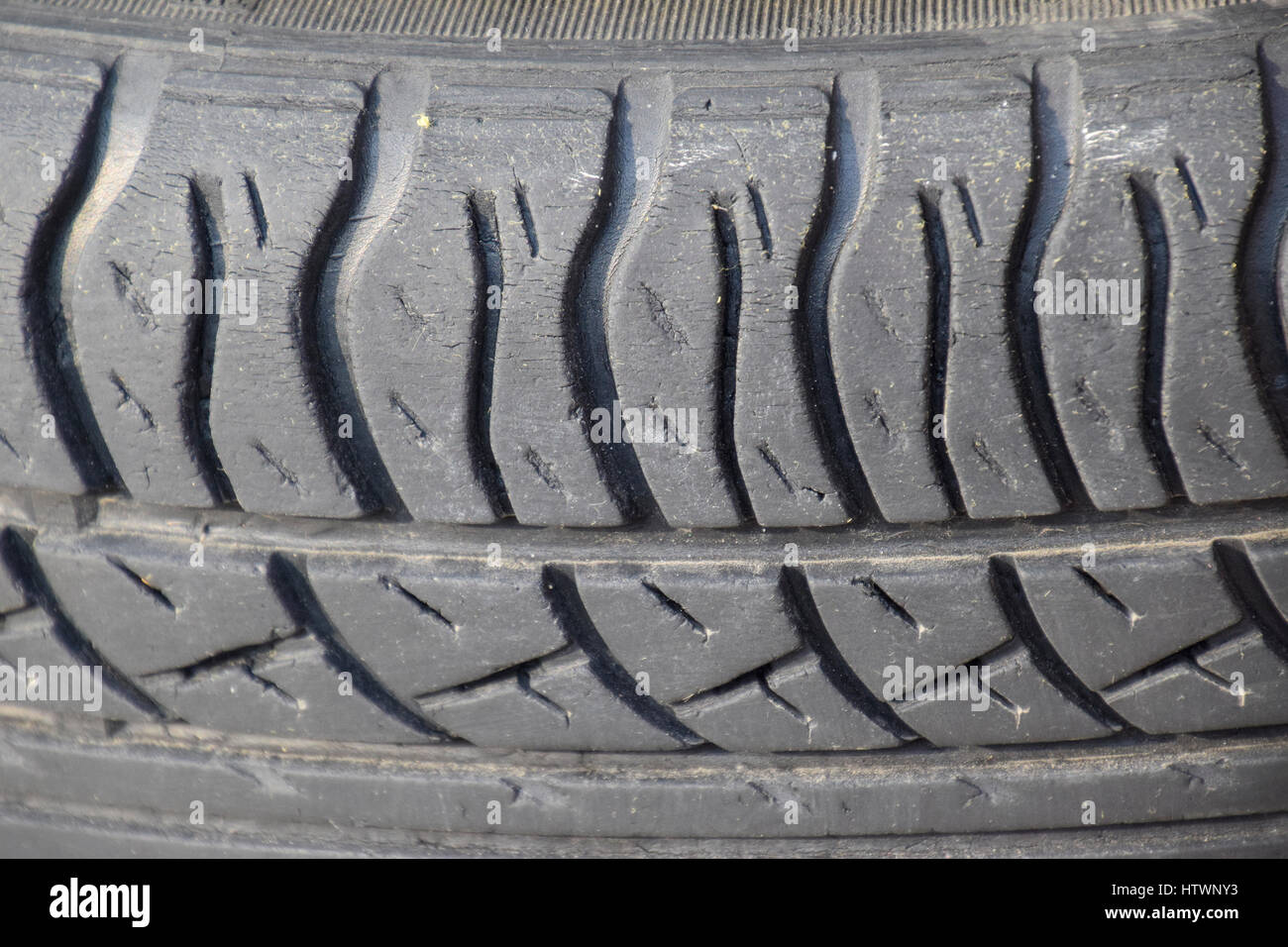 The background of the tread pattern of the car wheel. Rubber tires ...