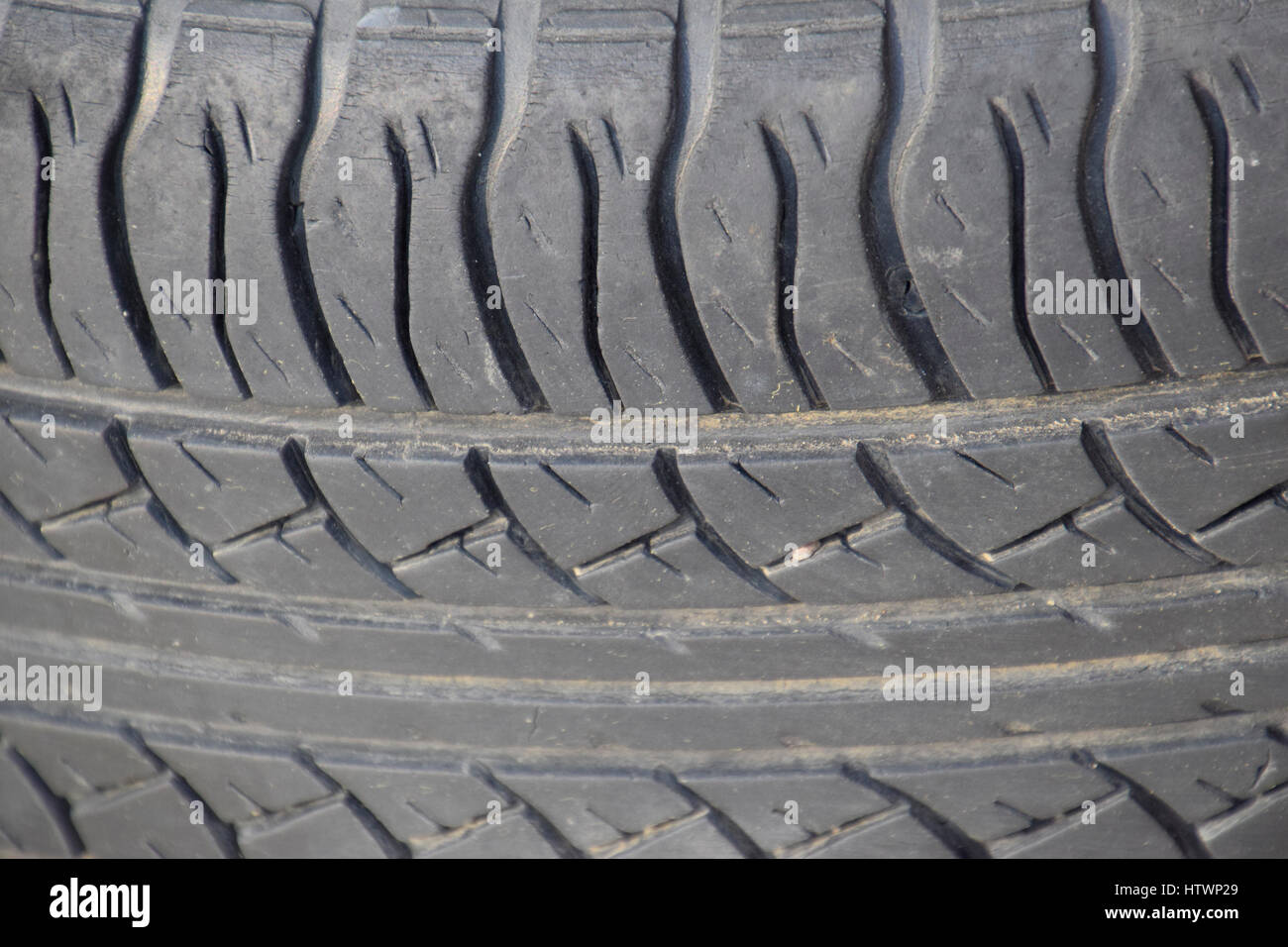 The background of the tread pattern of the car wheel. Rubber tires ...