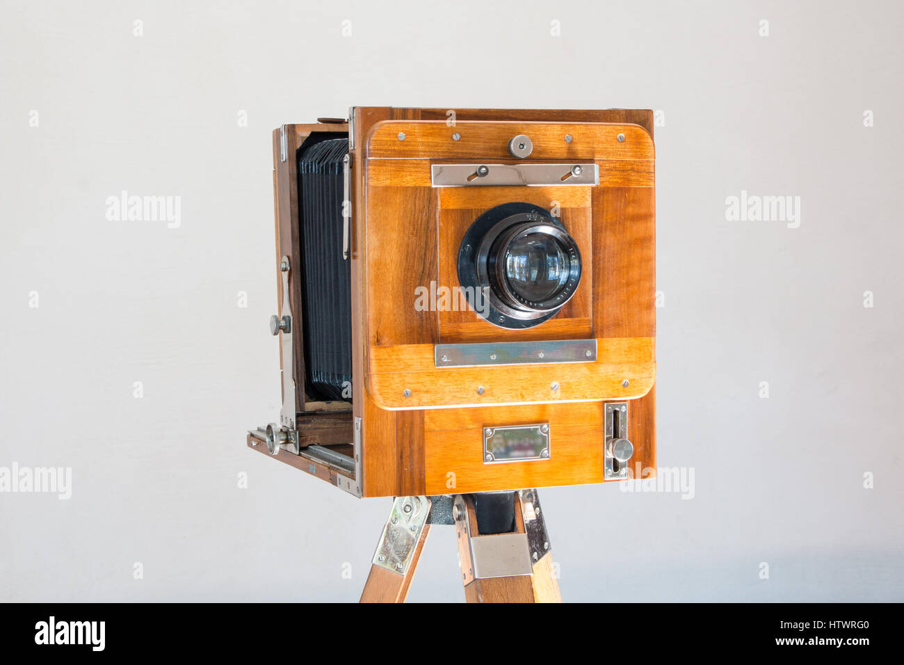 Old vintage big studio camera of wood and metal on white background ...