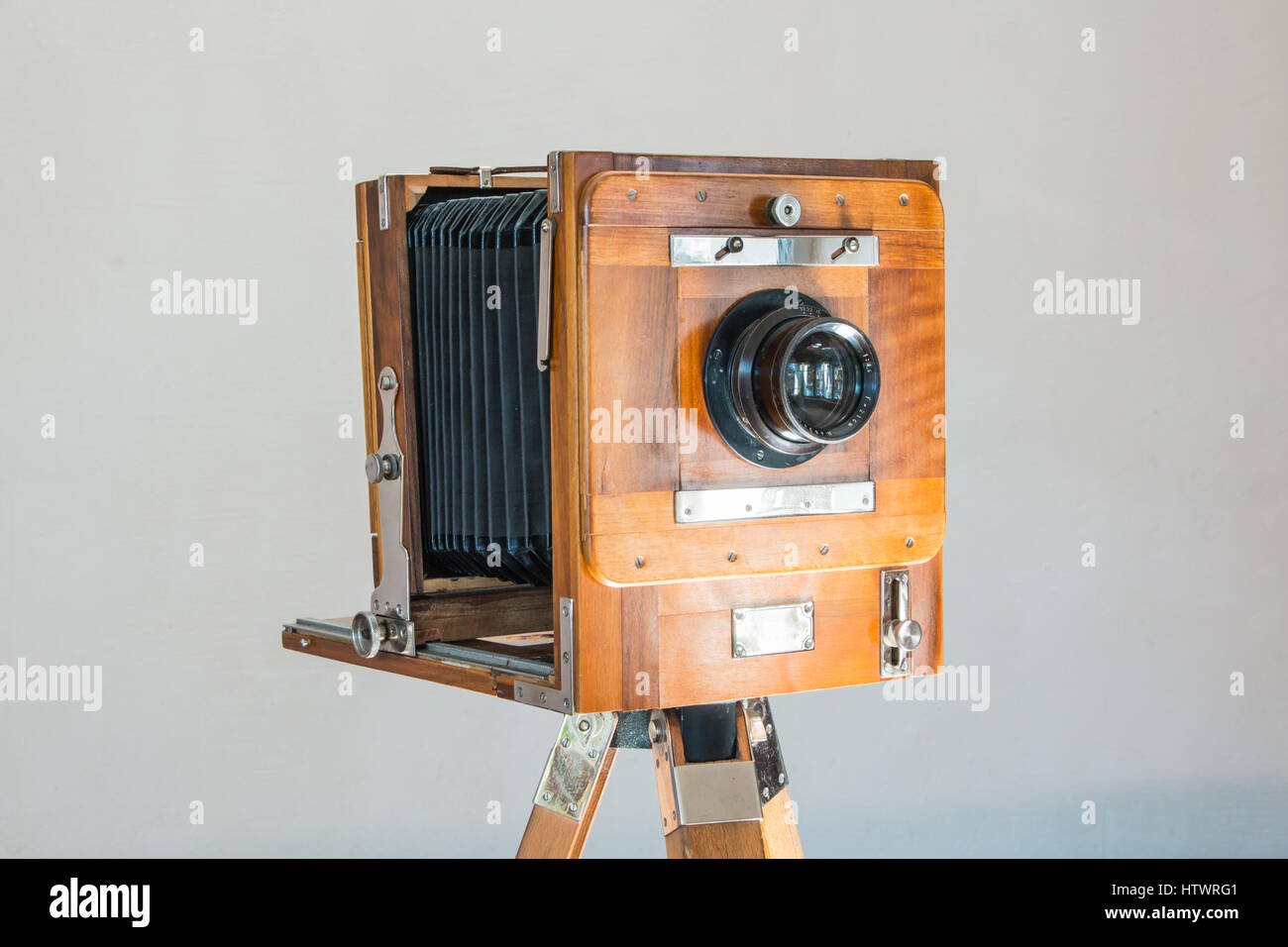 Old vintage big studio camera of wood and metal on white background ...