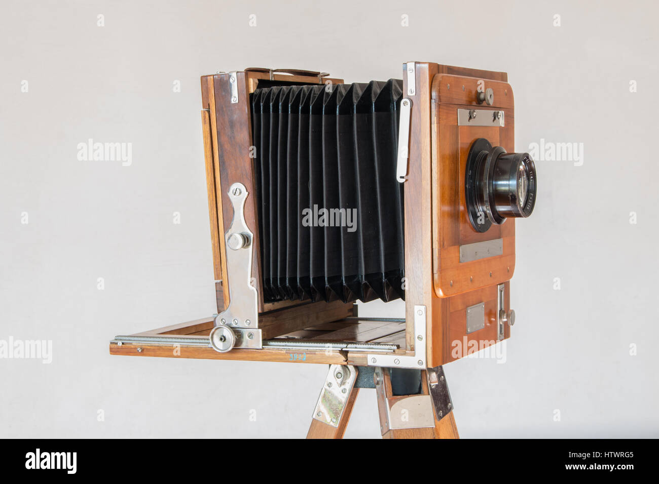 Old vintage big studio camera of wood and metal on white background ...