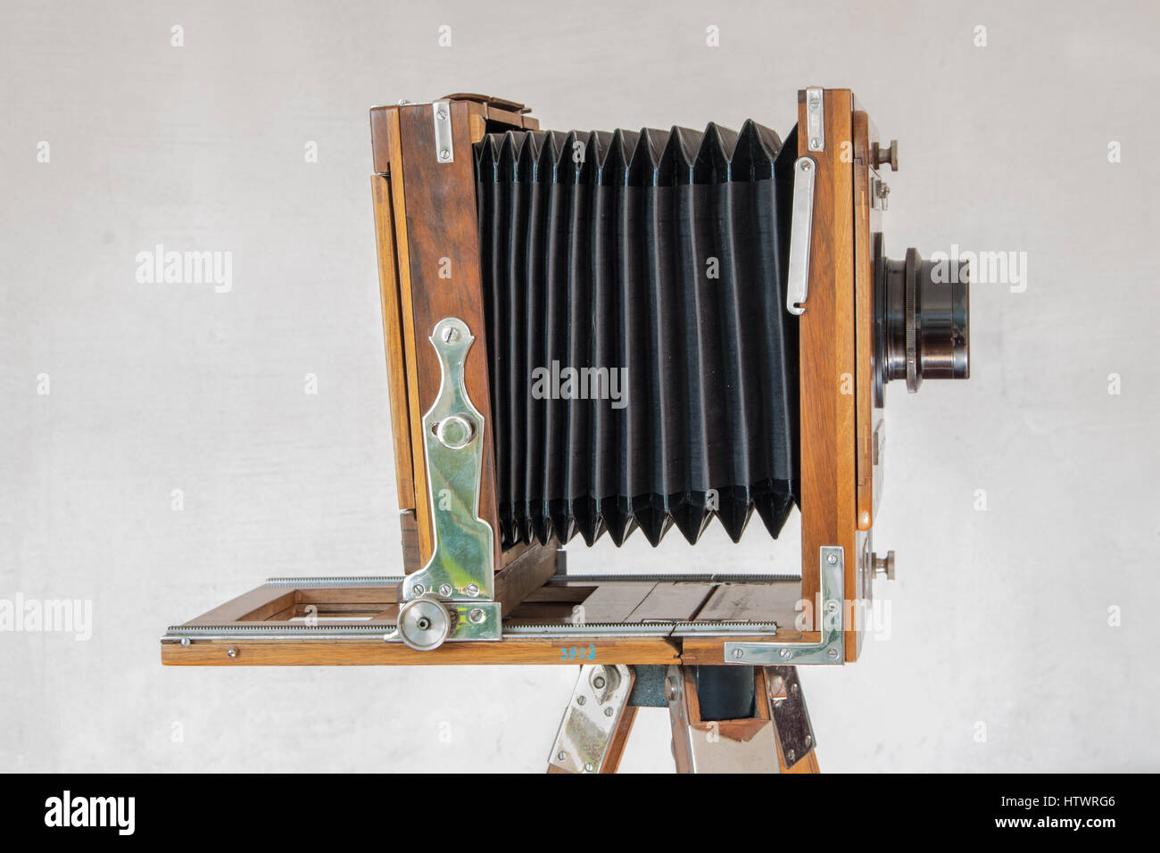 Old vintage big camera of wood and metal on white background close-up ...