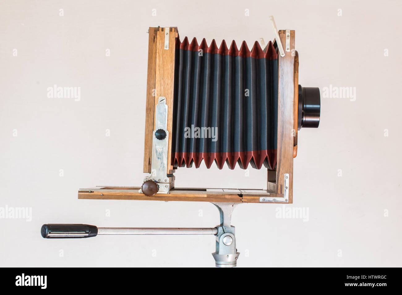 Old vintage big camera of wood and metal on white background close-up ...