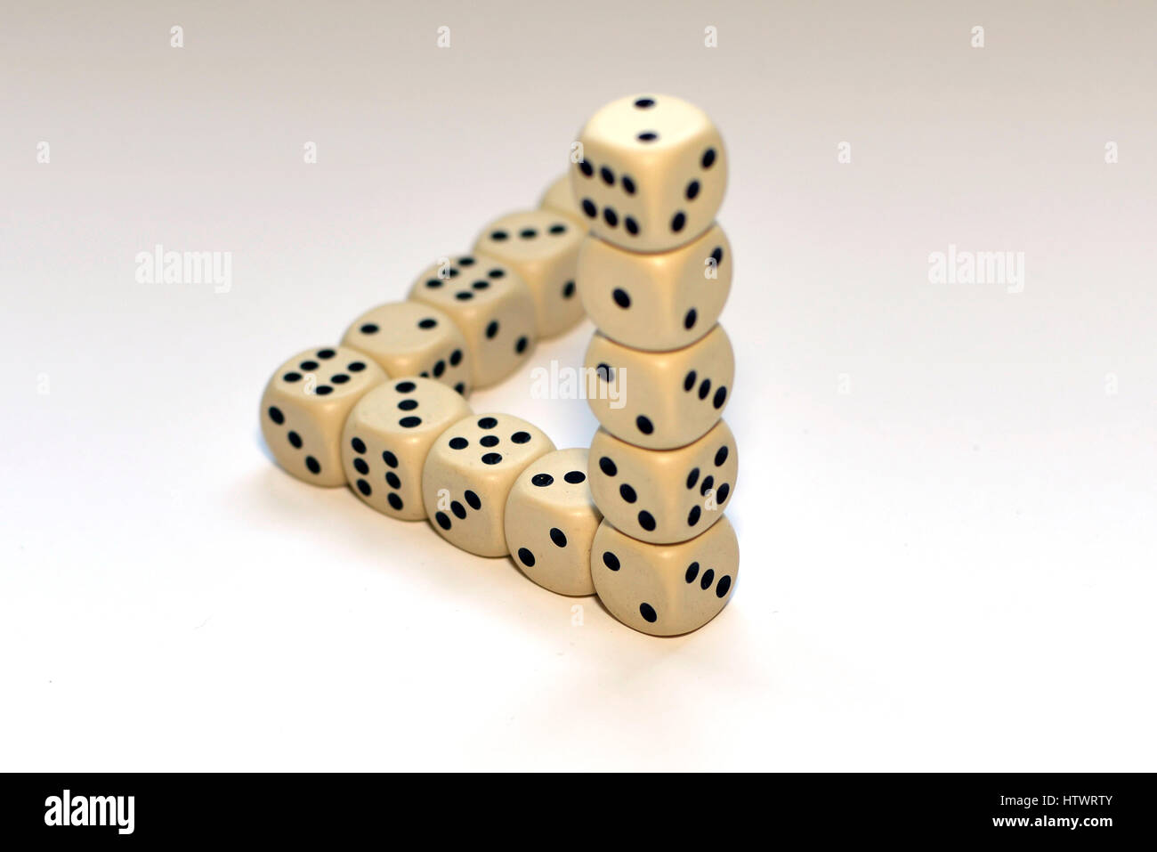 Optical illusion impossible triangle made with dice Stock Photo - Alamy