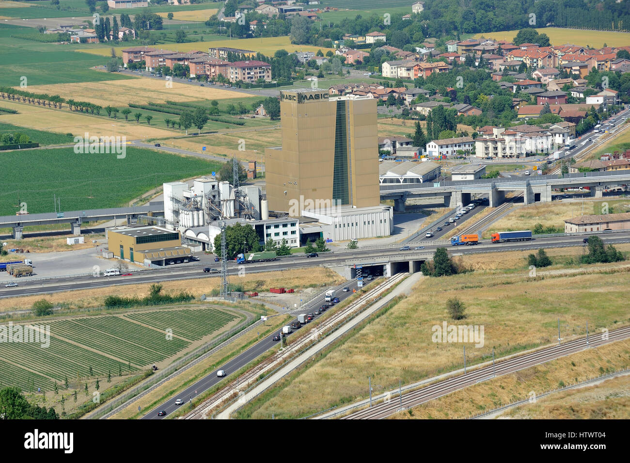 Aerial view of agricolture: cultivated fields, roads and urban traffic ...