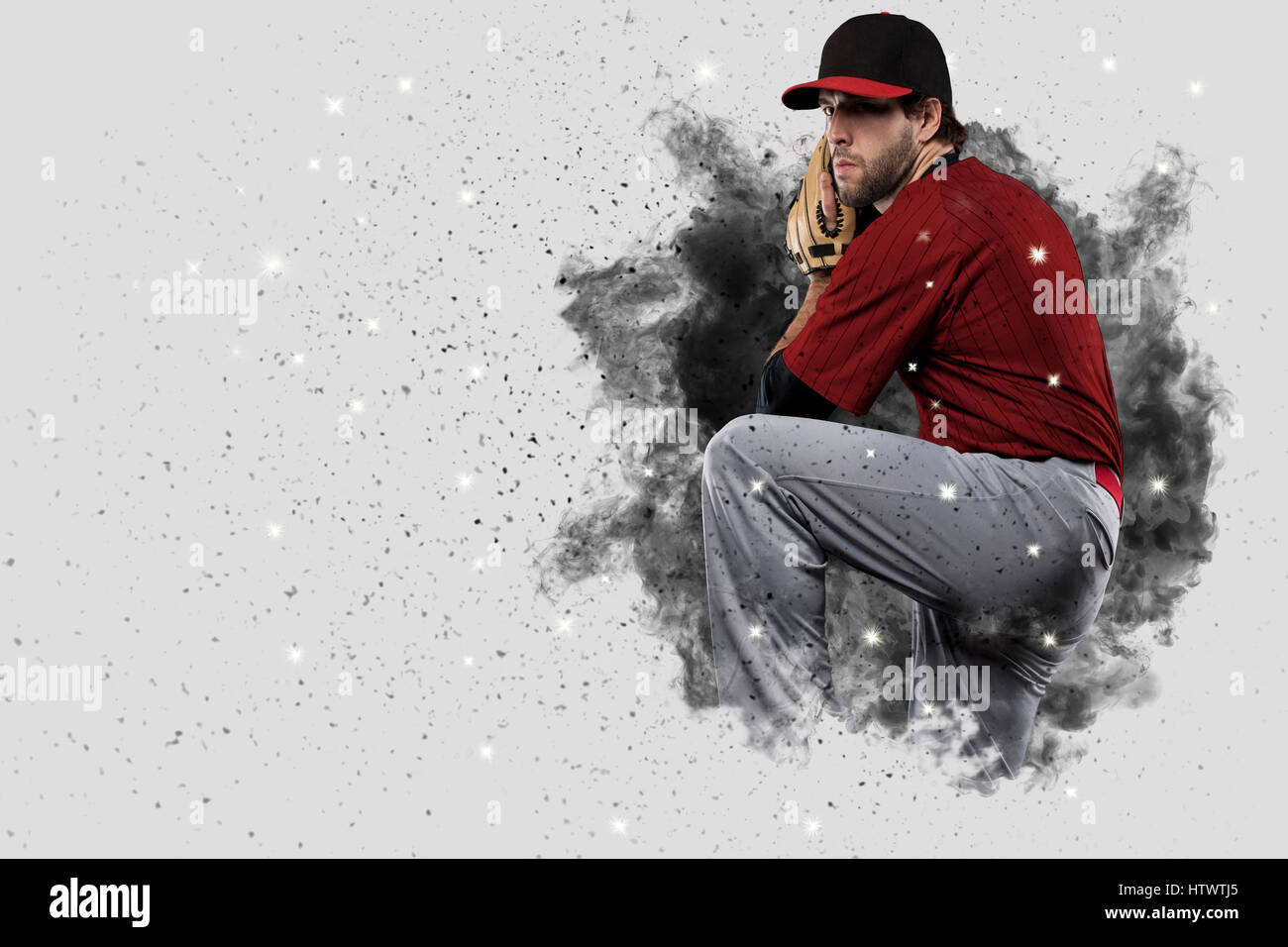 Pitcher Baseball Player with a red uniform coming out of a blast of ...