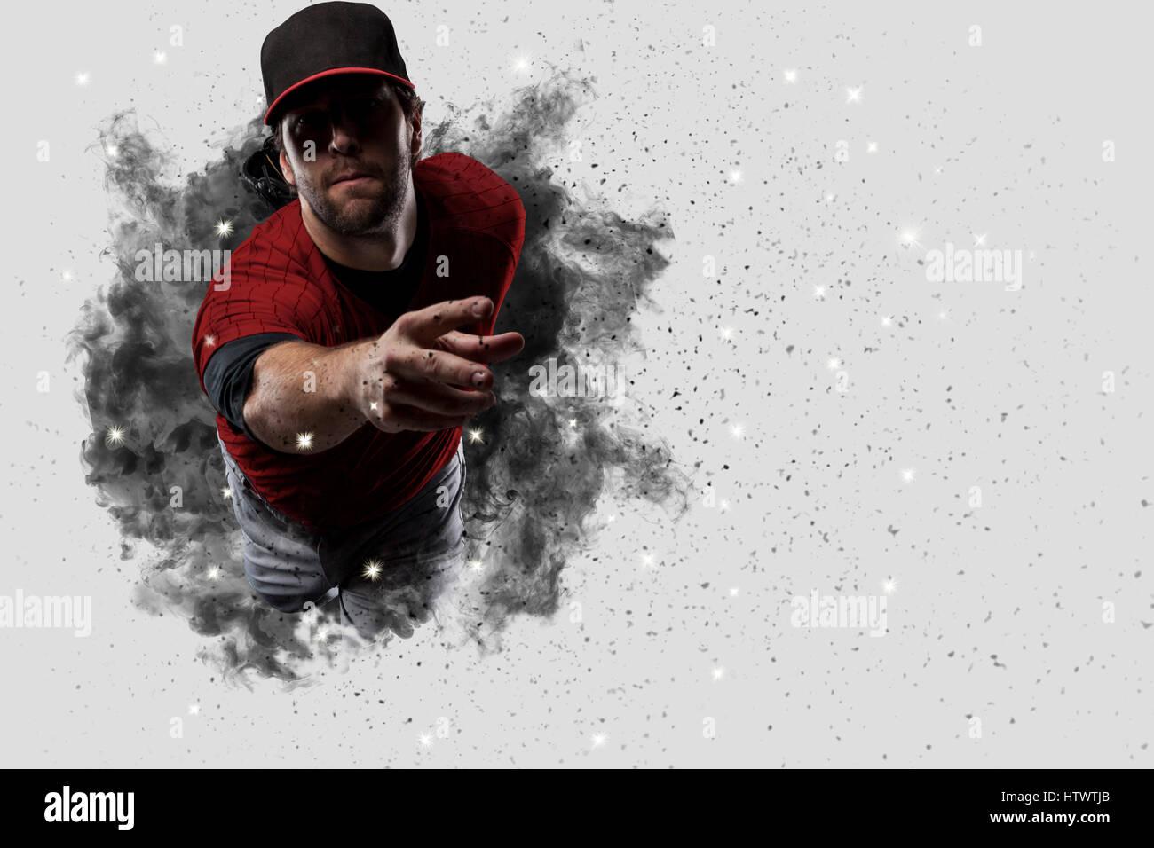 Pitcher Baseball Player with a red uniform coming out of a blast of ...