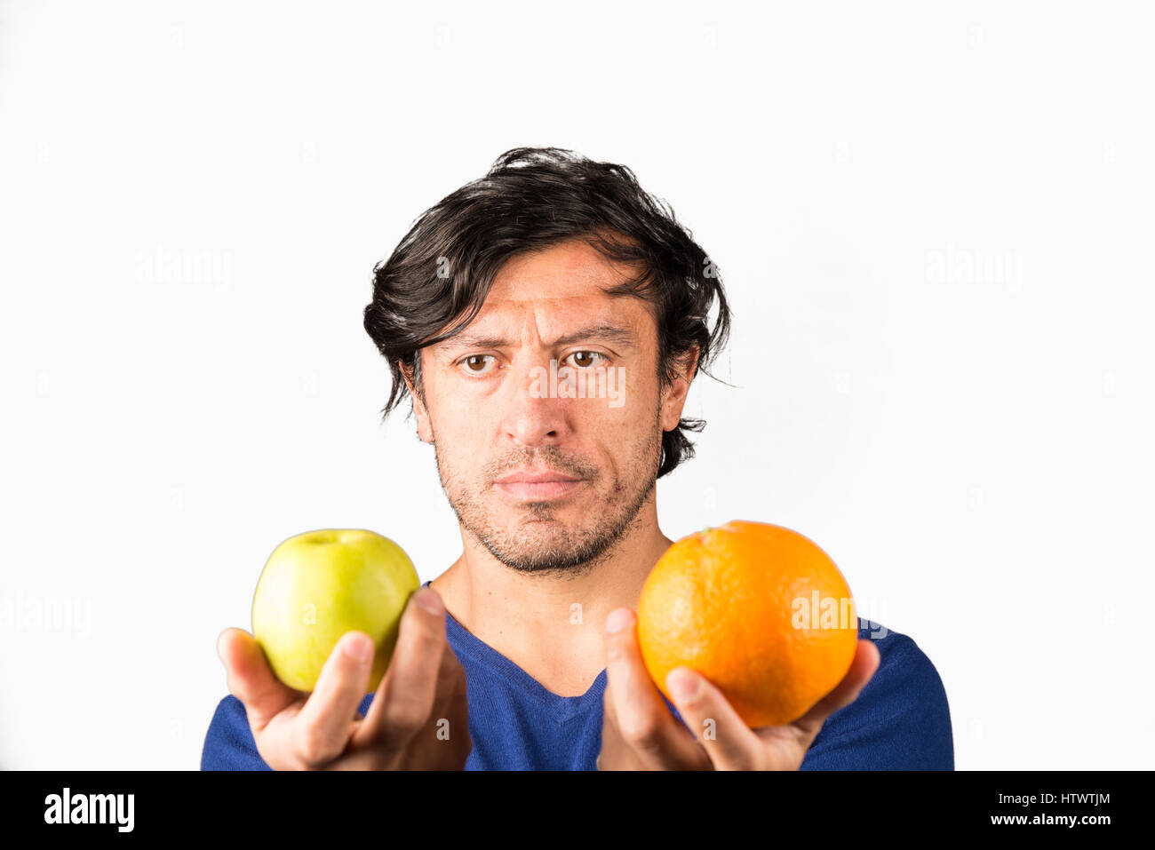 Comparing apples and oranges, a conceptual shot on a traditional saying ...