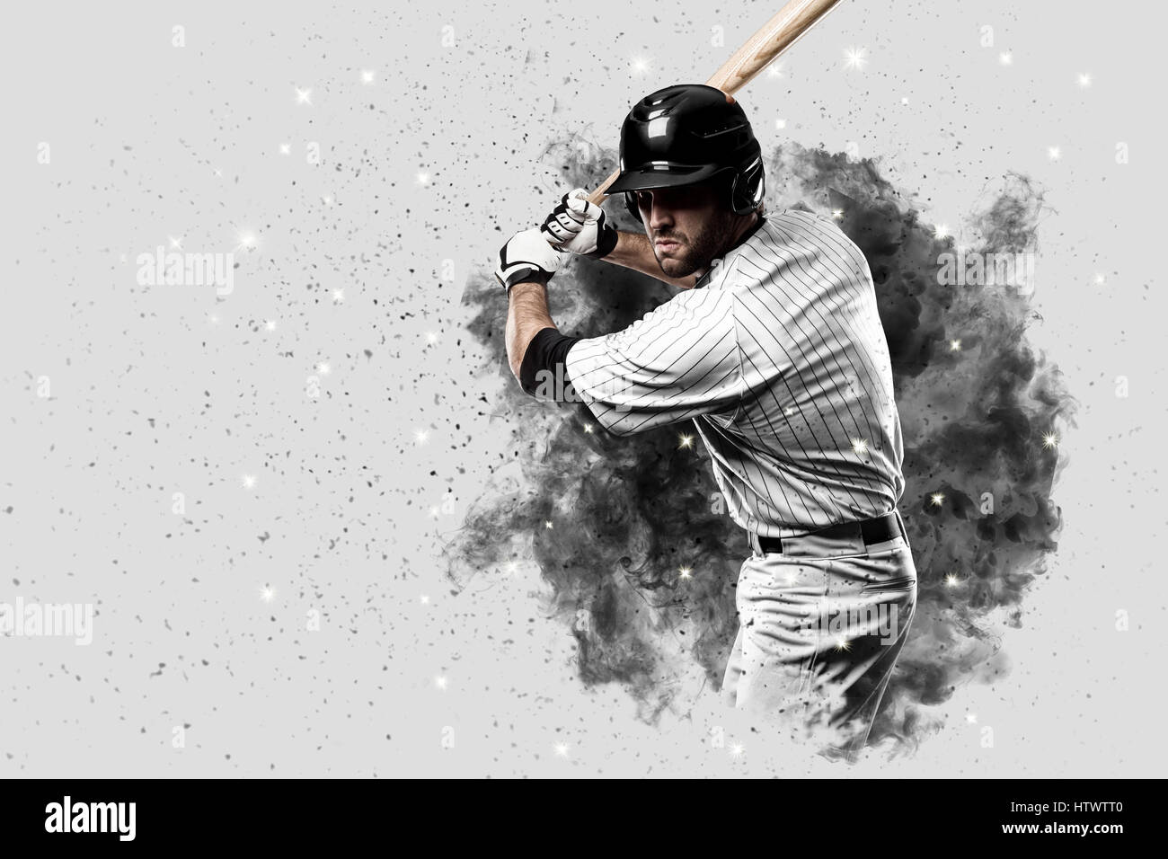 Baseball Player with a white uniform coming out of a blast of smoke ...