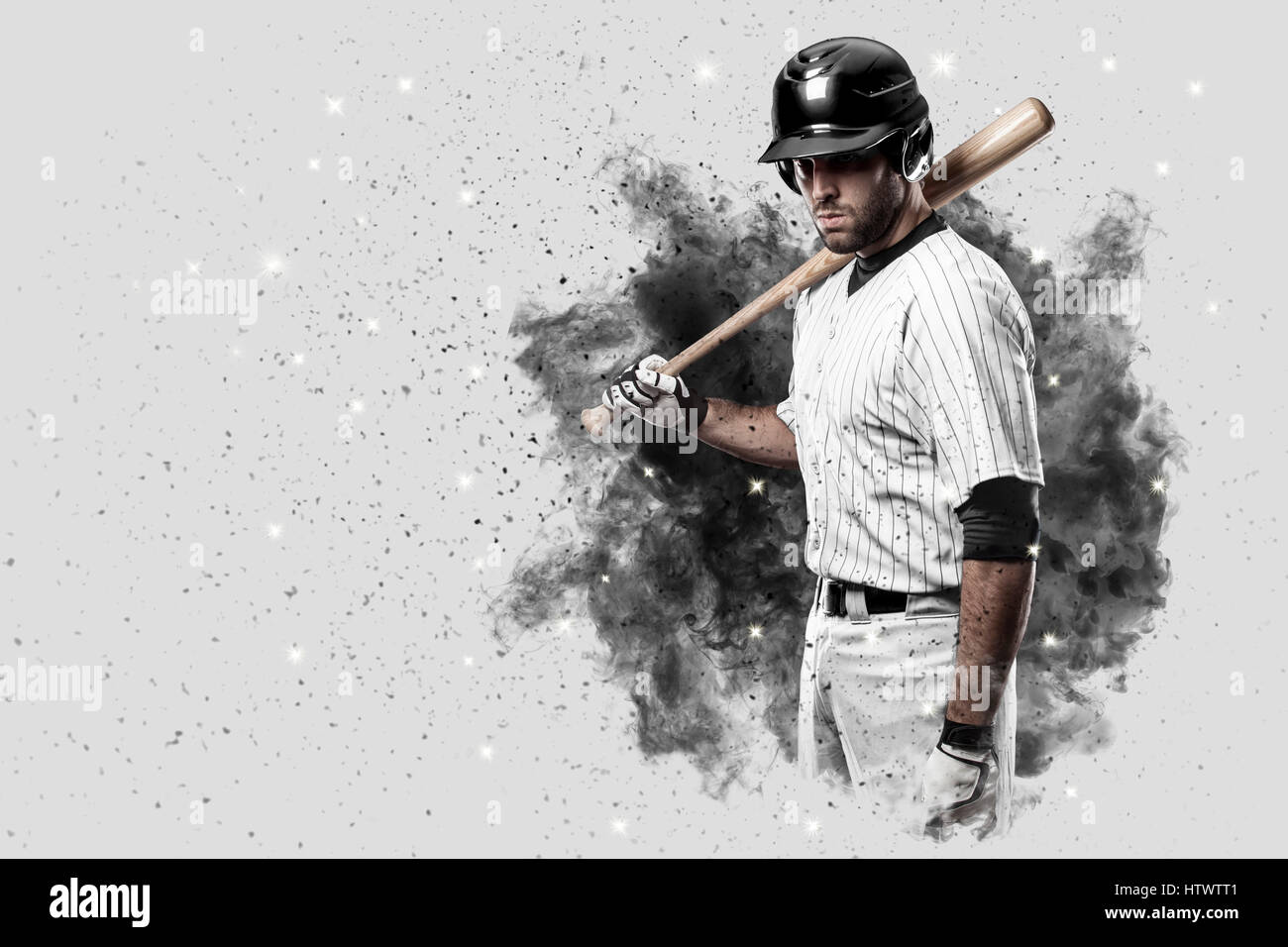 Baseball Player with a white uniform coming out of a blast of smoke ...