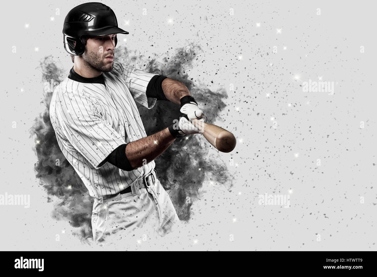 Baseball Player with a white uniform coming out of a blast of smoke ...