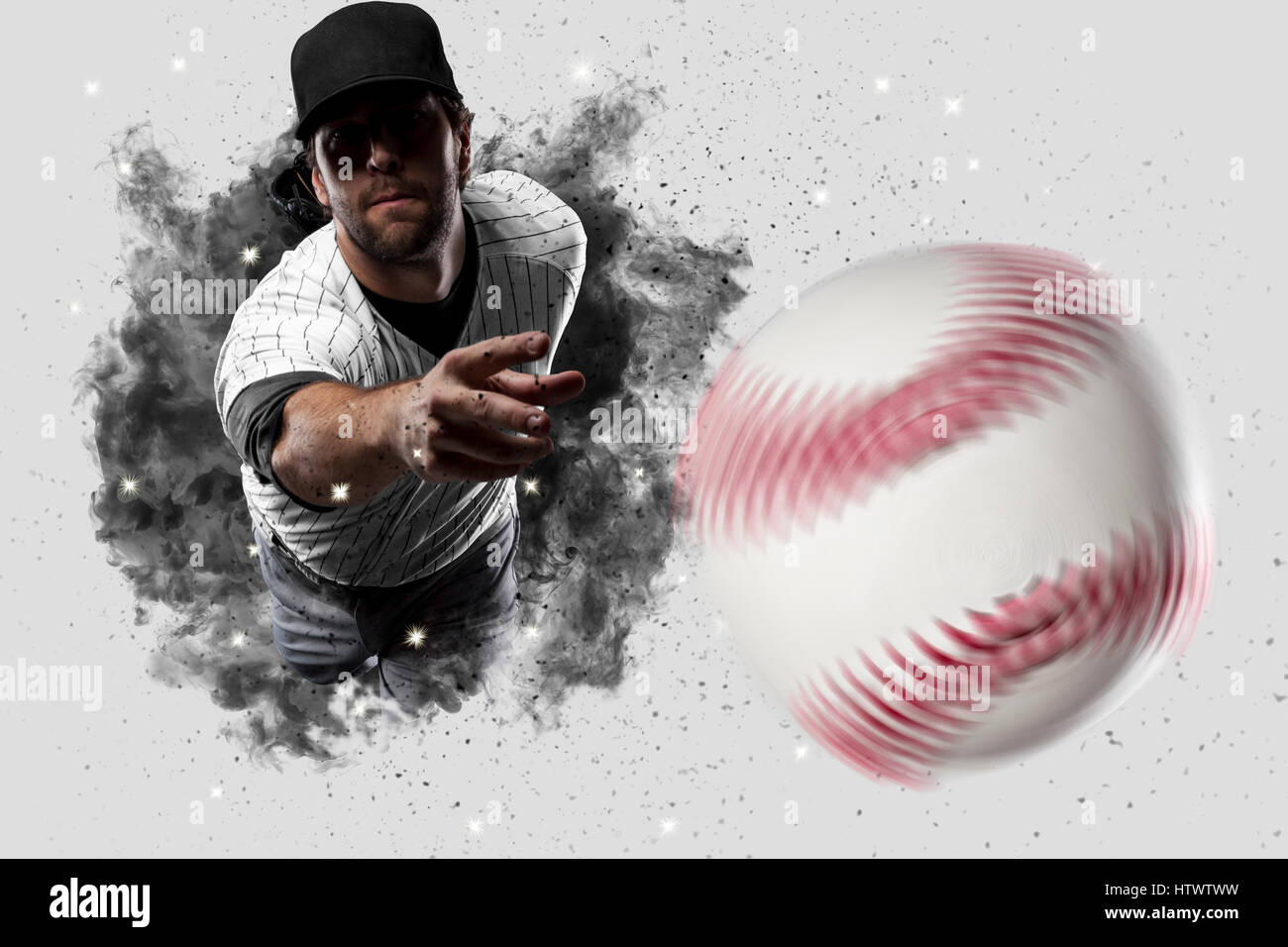 Pitcher Baseball Player with a white uniform coming out of a blast of ...