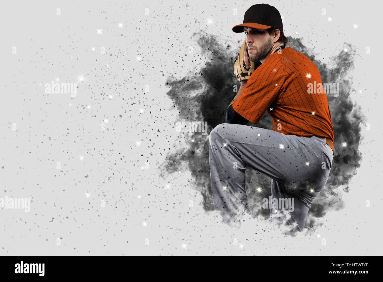 Pitcher Baseball Player with a orange uniform coming out of a blast of ...