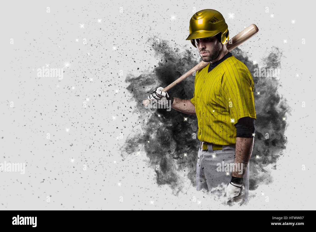 Baseball Player with a yellow uniform coming out of a blast of smoke ...