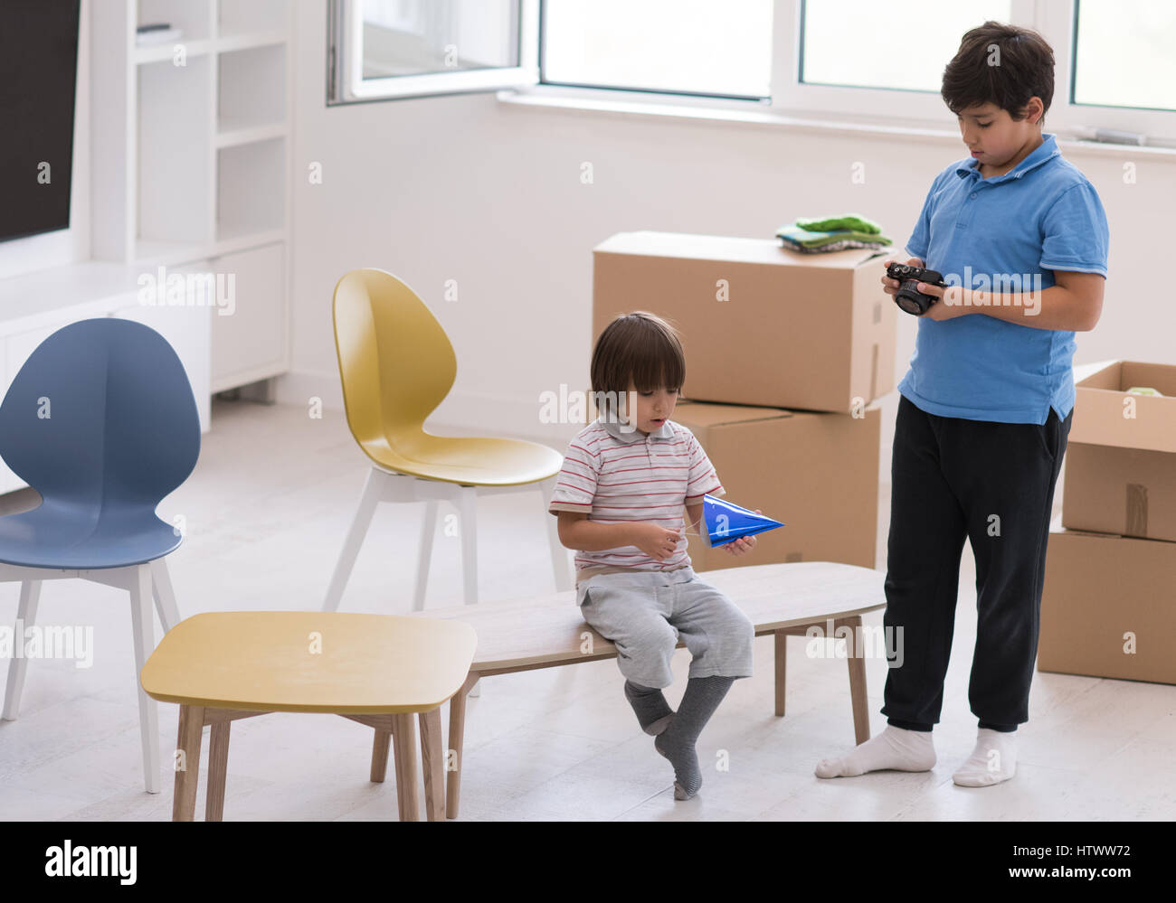 happy young boys enjoying their new modern home Stock Photo - Alamy
