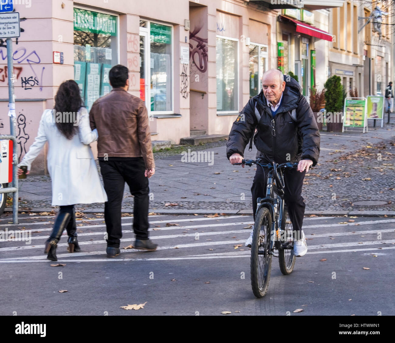 Senior male cyclist cycling in city street, urban cycling, elderly ...