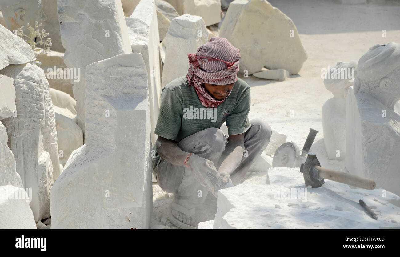 Man making stone sculpture Stock Photo - Alamy