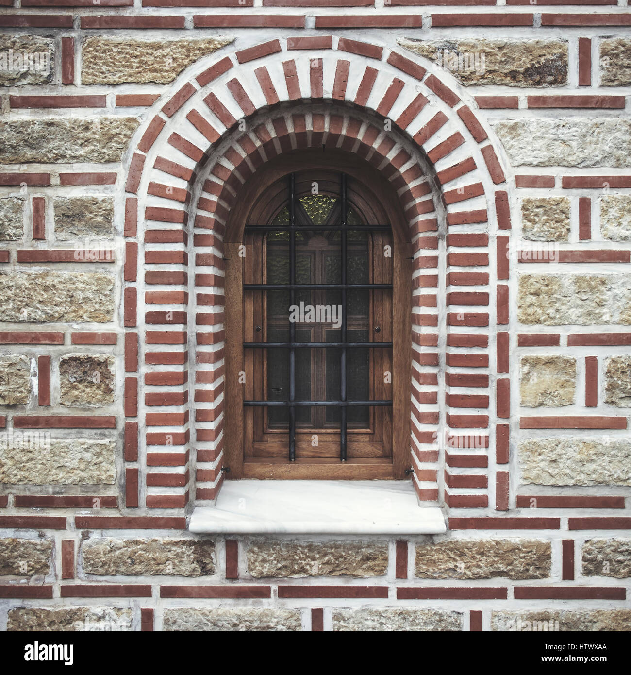 The ancient rounded window in close up Stock Photo - Alamy