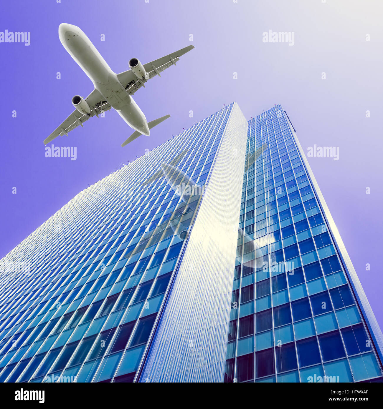 aeroplane flying over the skyscrapers. architecture building with ...