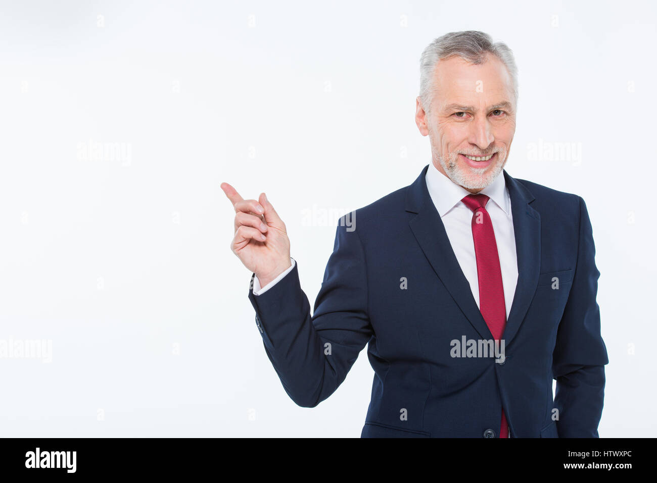 Businessman pointing with finger Stock Photo - Alamy