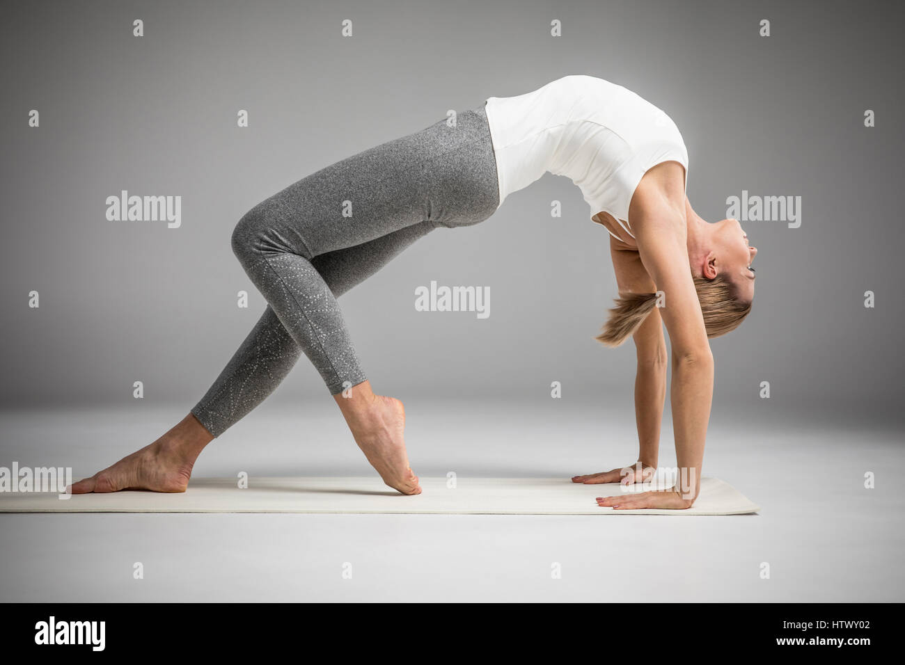 Woman standing in yoga position Stock Photo - Alamy