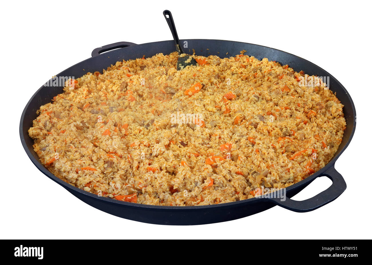 Fast street food of the big city - metal big frying pan with hot pilaf ...