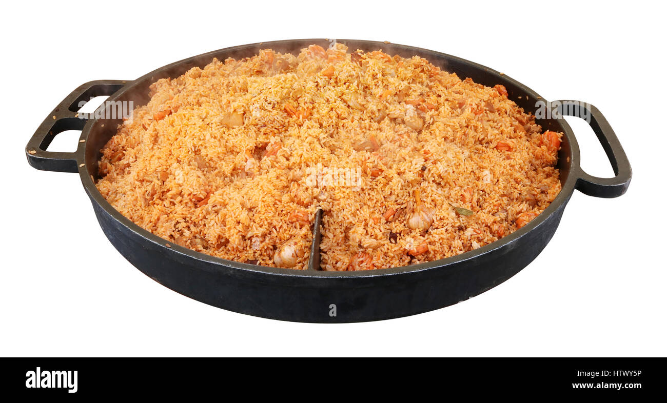 Fast food of the big city - metal big frying pan with hot Asian pilaf ...