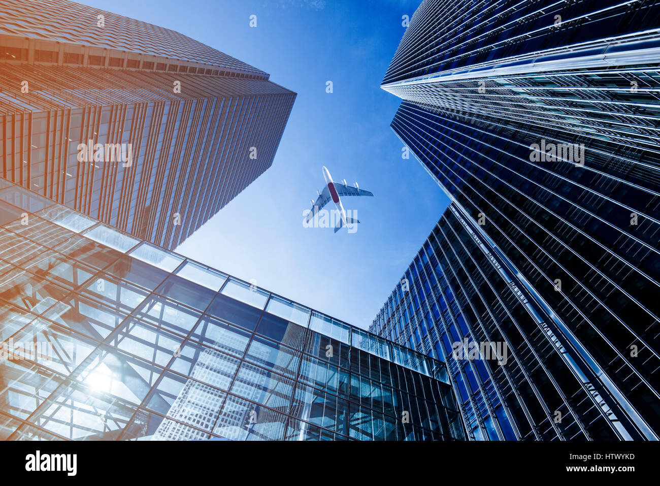 Airplane Flying Over Business Skyscrapers High Resolution Stock ...
