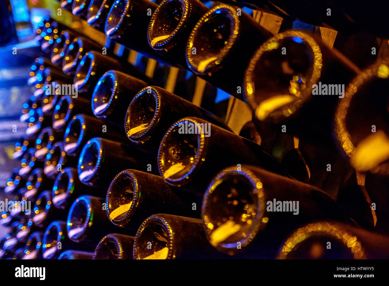 Bottles of champagne maturing in a wine cellar at Lanson, Reims France ...
