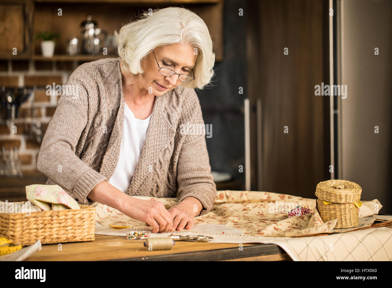 Woman sewing cloth Stock Photo - Alamy