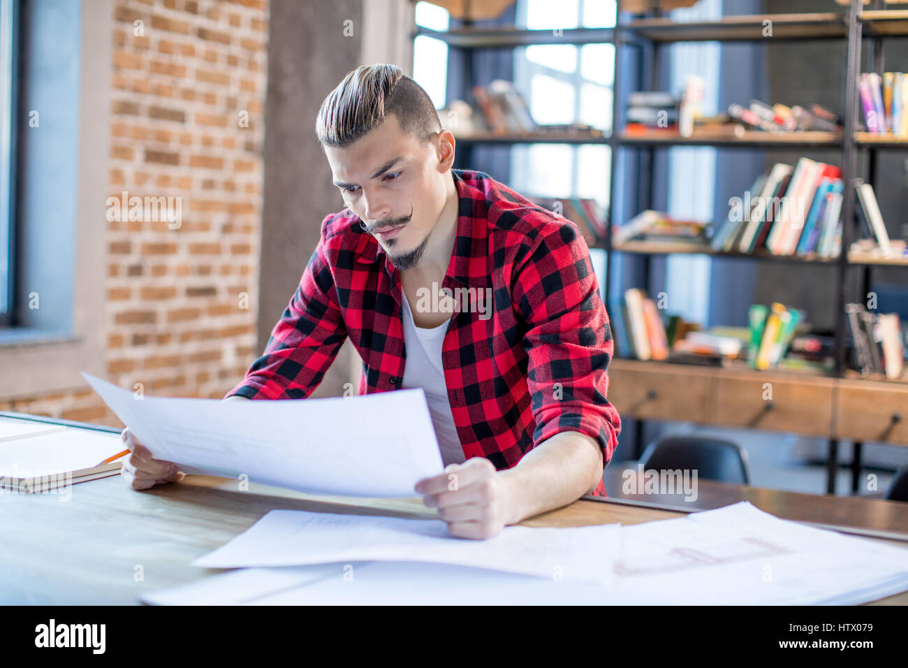 Male architect with blueprints Stock Photo - Alamy