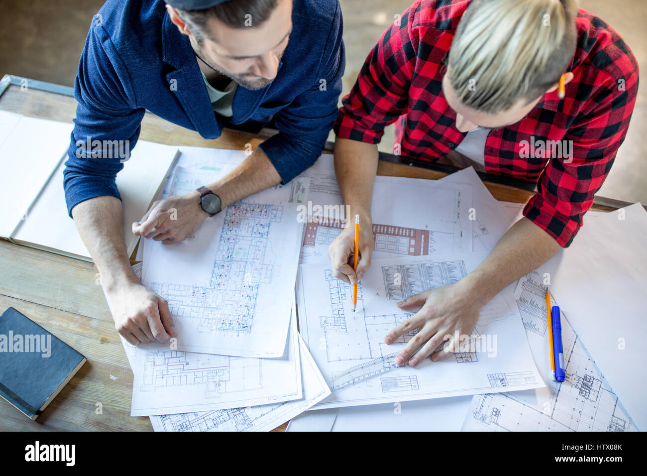 Architects discussing blueprints Stock Photo - Alamy Architects discussing blueprints Stock Photo - Alamy