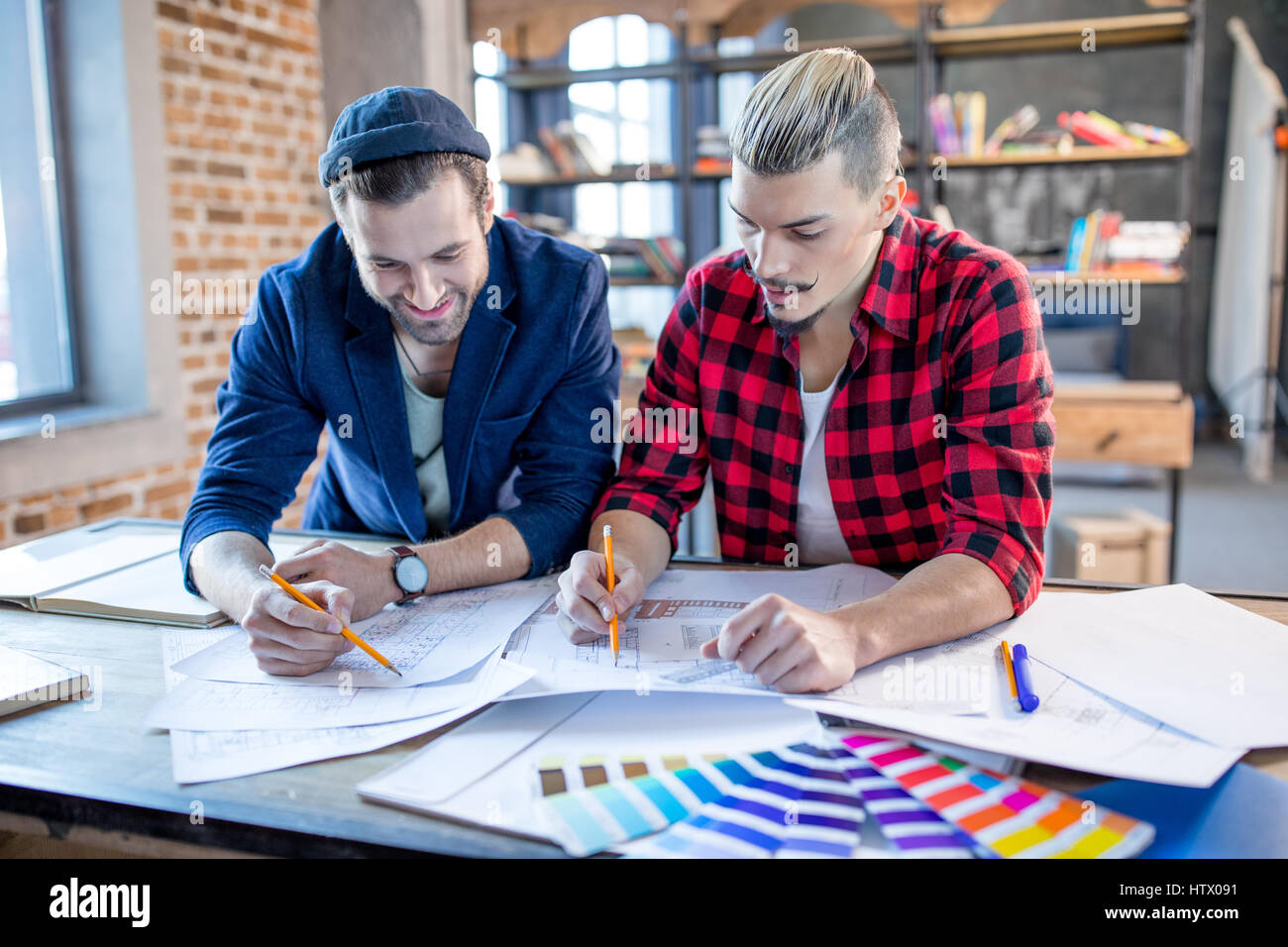 Architects discussing blueprints Stock Photo - Alamy Architects discussing blueprints Stock Photo - Alamy