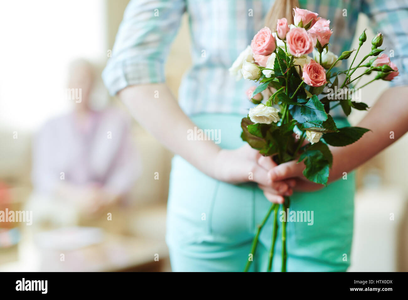 Bunch of fresh roses for grandmother held by girl Stock Photo - Alamy
