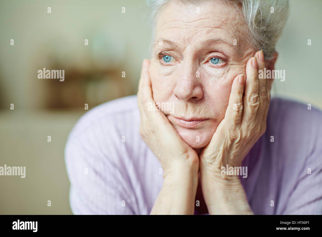 Mature female with sad expression Stock Photo - Alamy