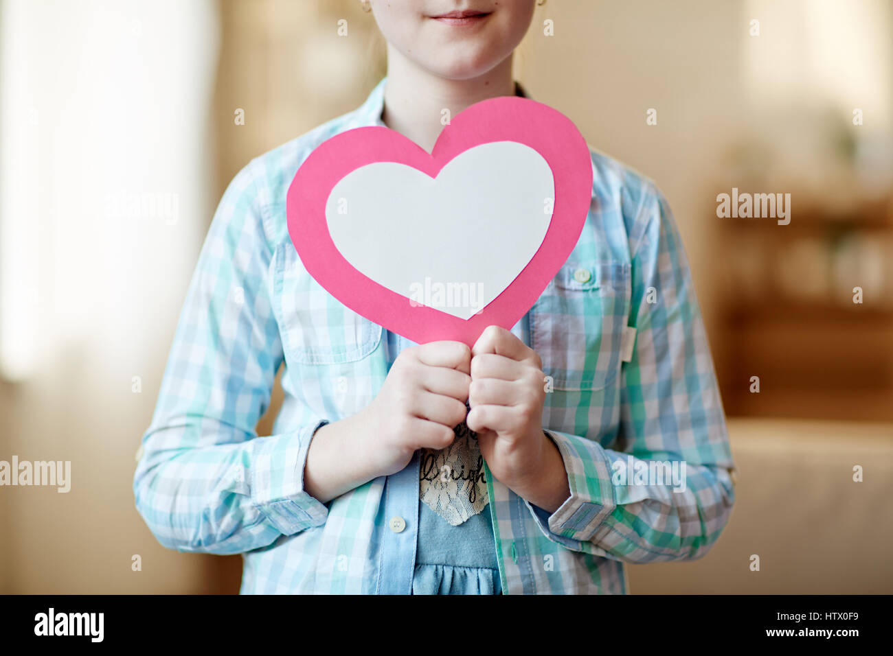Child holding symbol of love Stock Photo - Alamy