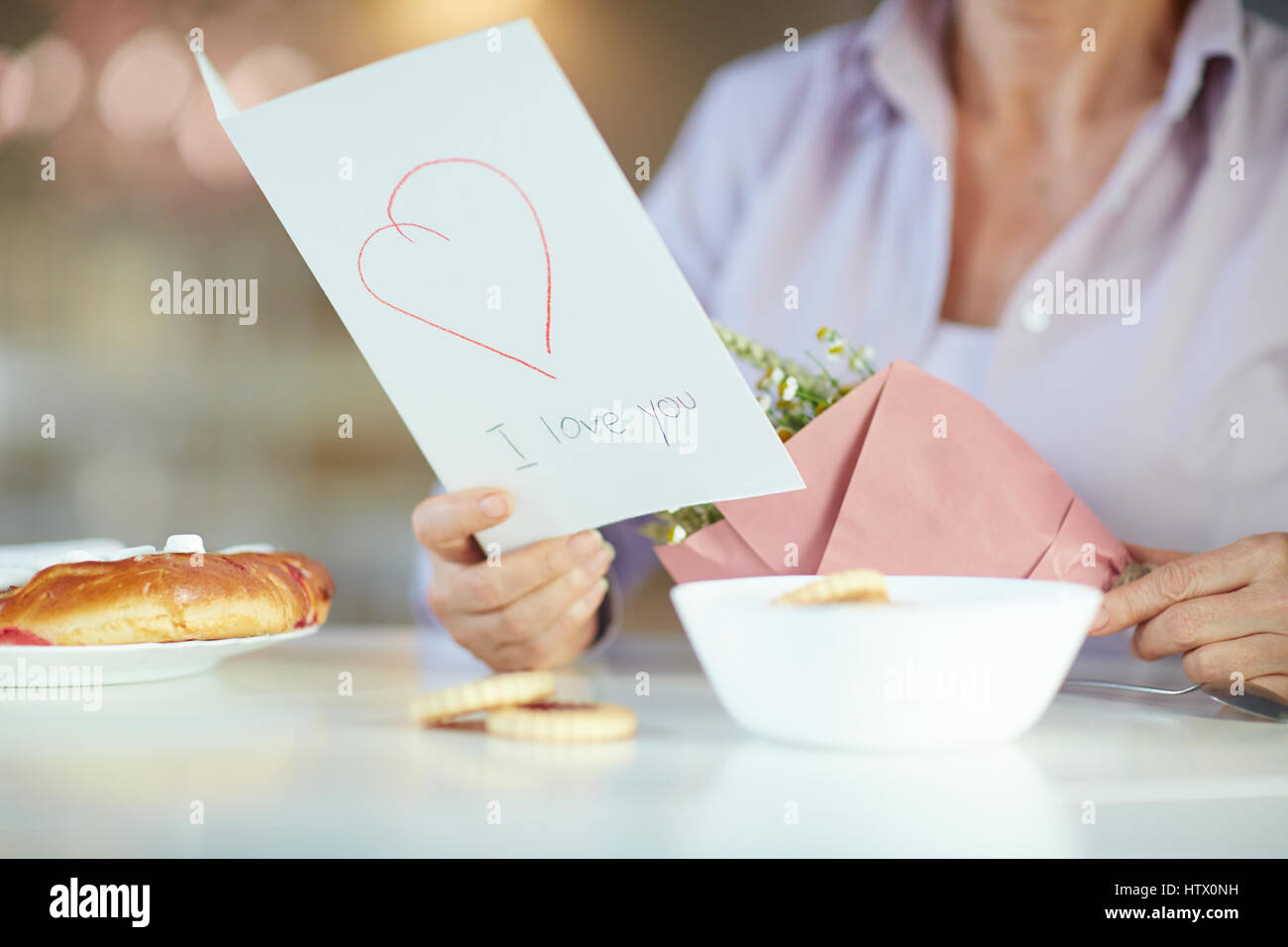 Handmade greeting-card being read by female Stock Photo - Alamy
