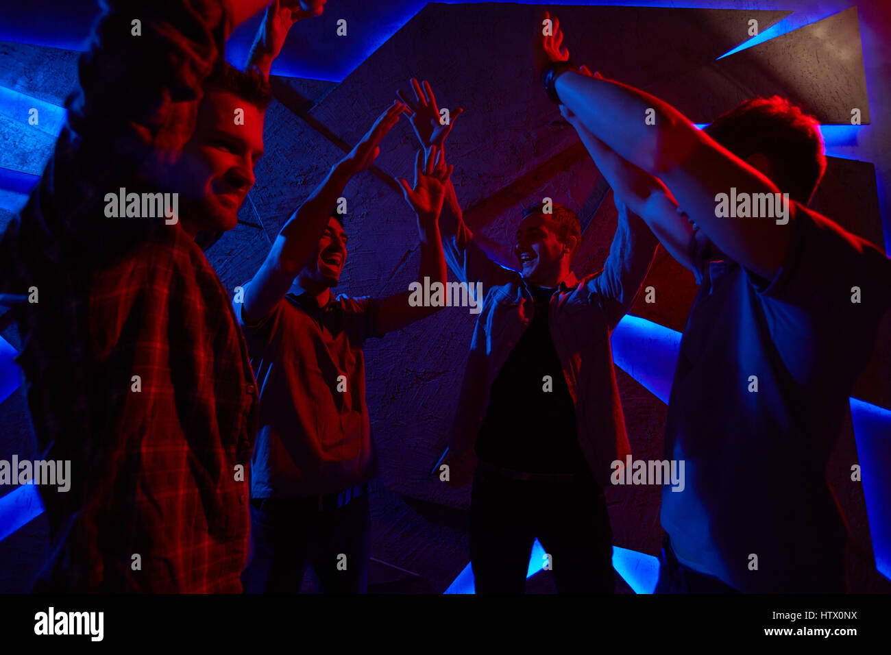 Male dancers raising their arms during dance Stock Photo - Alamy