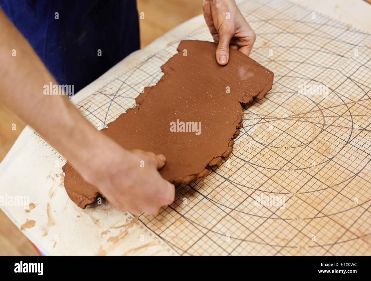 Rolled clay workpiece on potter workplace Stock Photo - Alamy